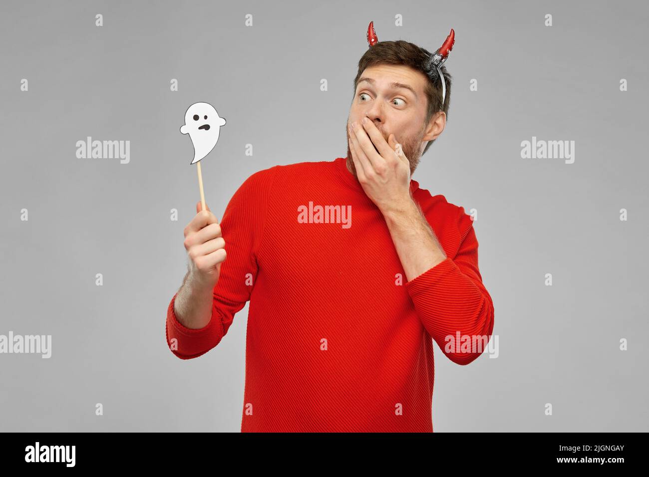 man in halloween costume of devil over grey Stock Photo - Alamy