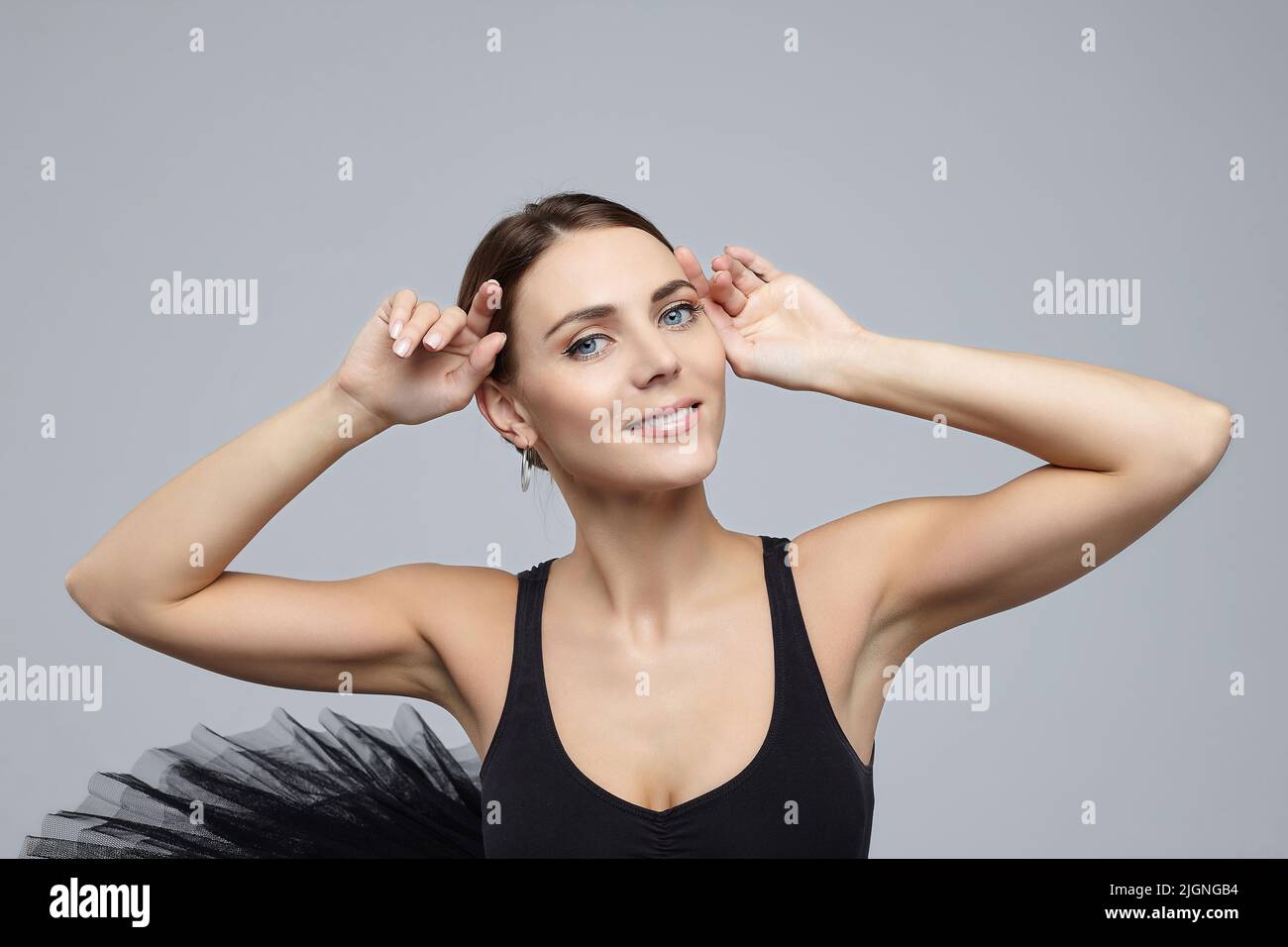portrait of attractive ballerina. photo shoot in the studio on a white ...
