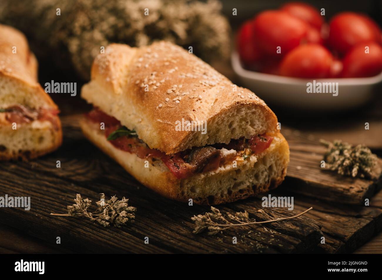 Traditional street food of Sicily, Italy. Pane cunzato on wooden table ...