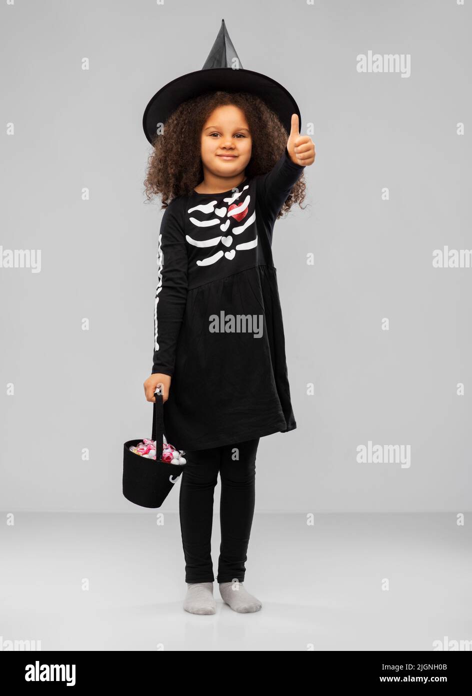 girl with candies trick-or-treating on halloween Stock Photo - Alamy