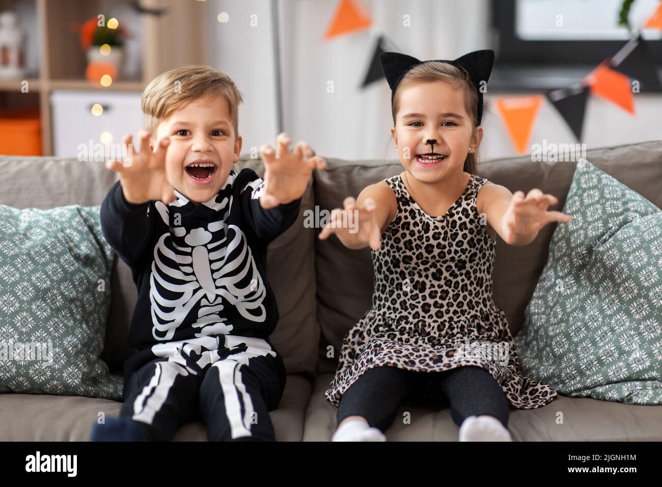 kids in halloween costumes having fun at home Stock Photo - Alamy