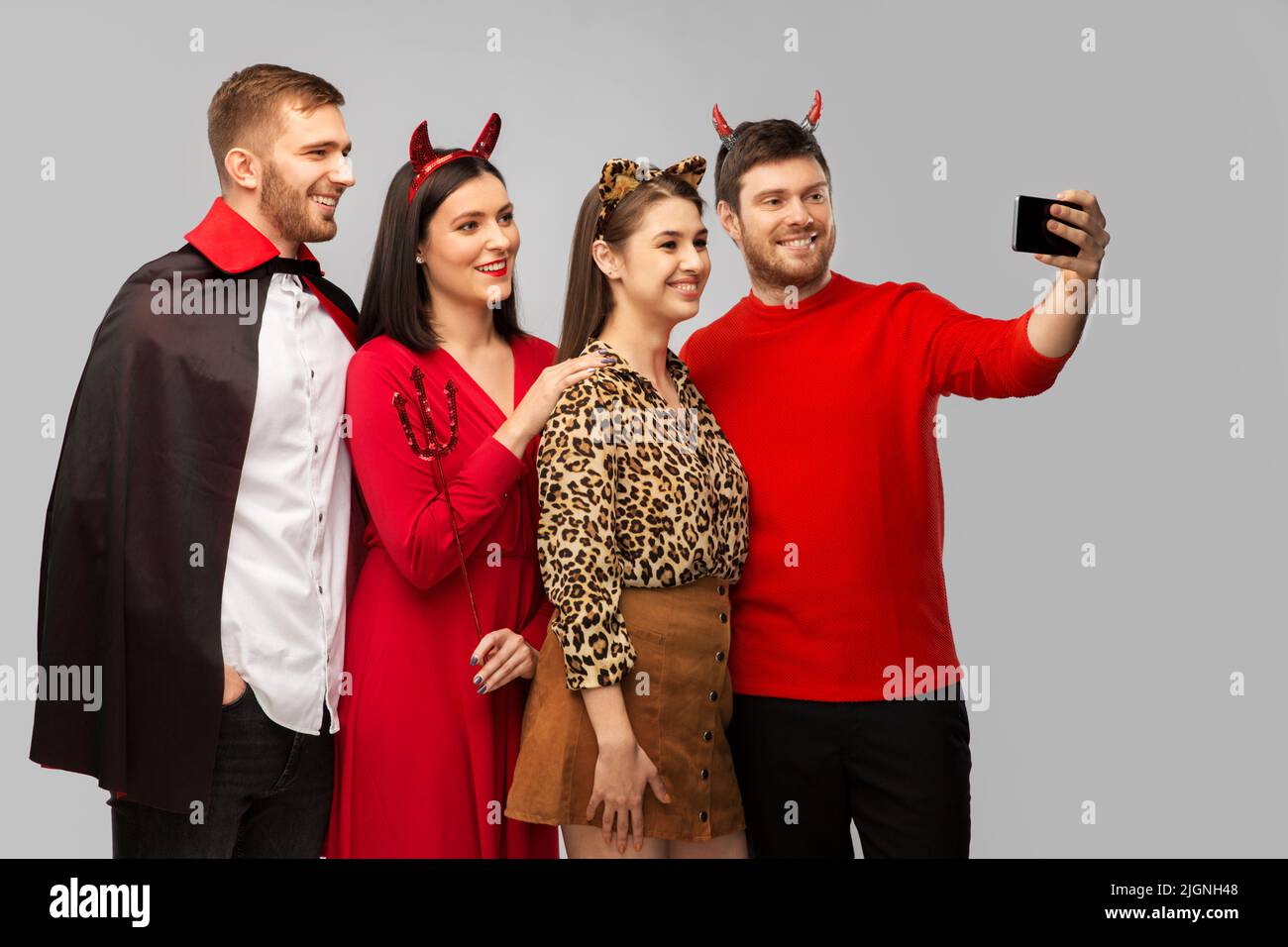 happy friends in halloween costumes taking selfie Stock Photo - Alamy