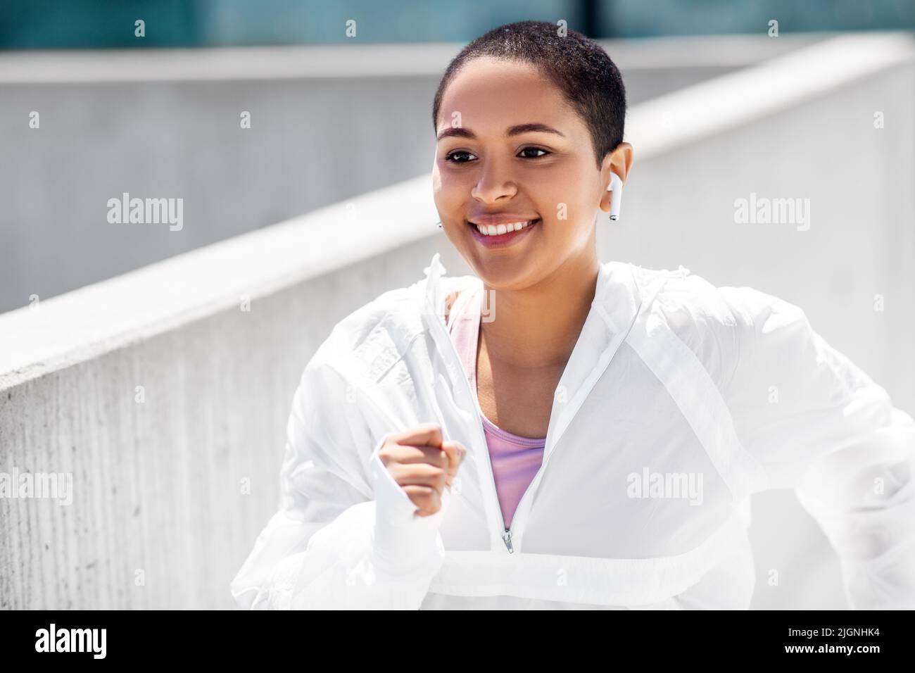 african american woman running upstairs outdoors Stock Photo - Alamy