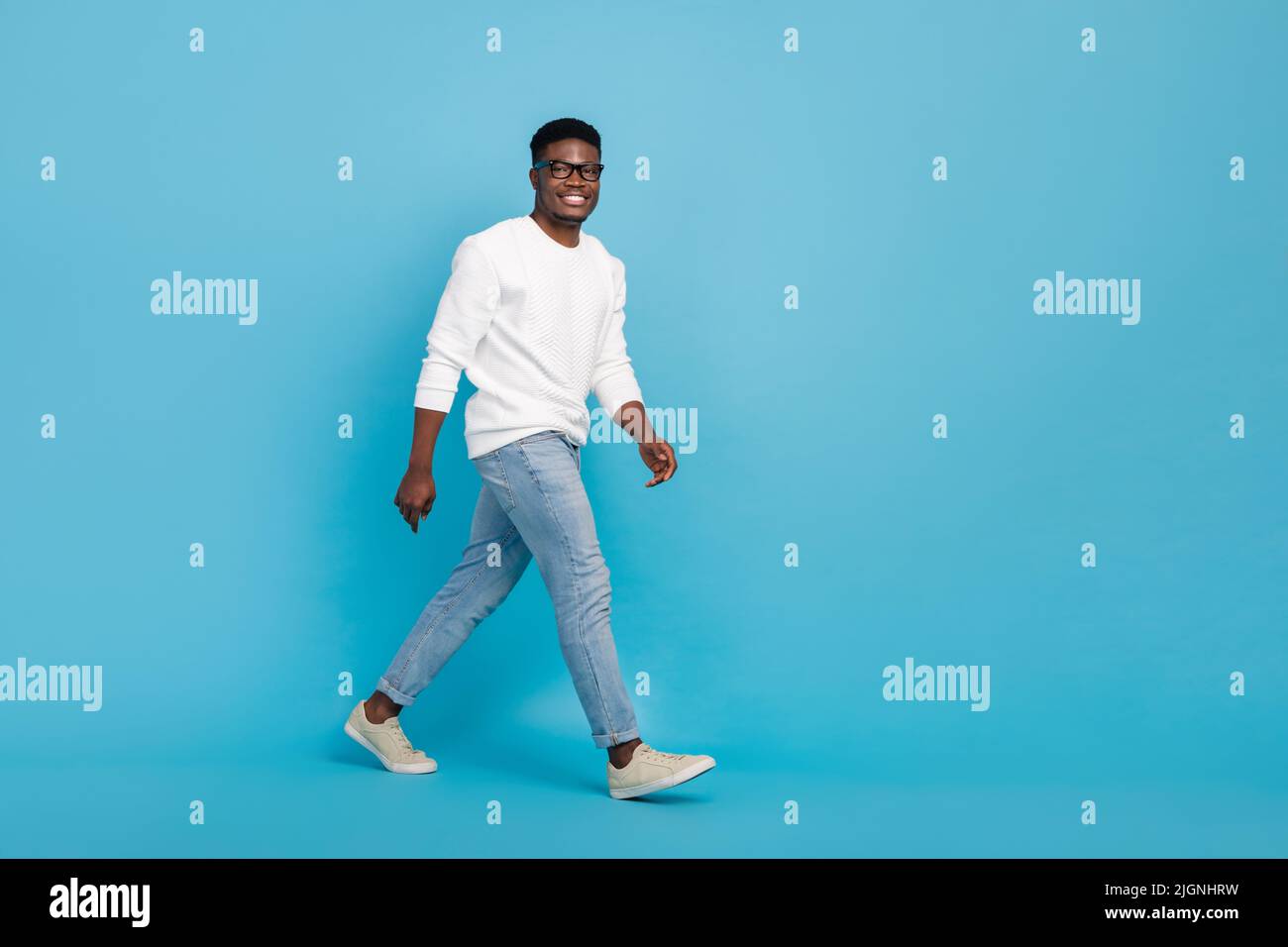 Full body profile photo of positive cheerful person walking toothy ...