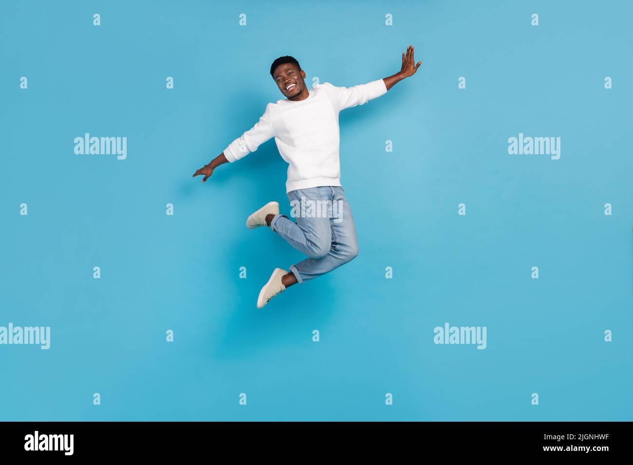 Full size photo of overjoyed person enjoy freedom jumping isolated on ...