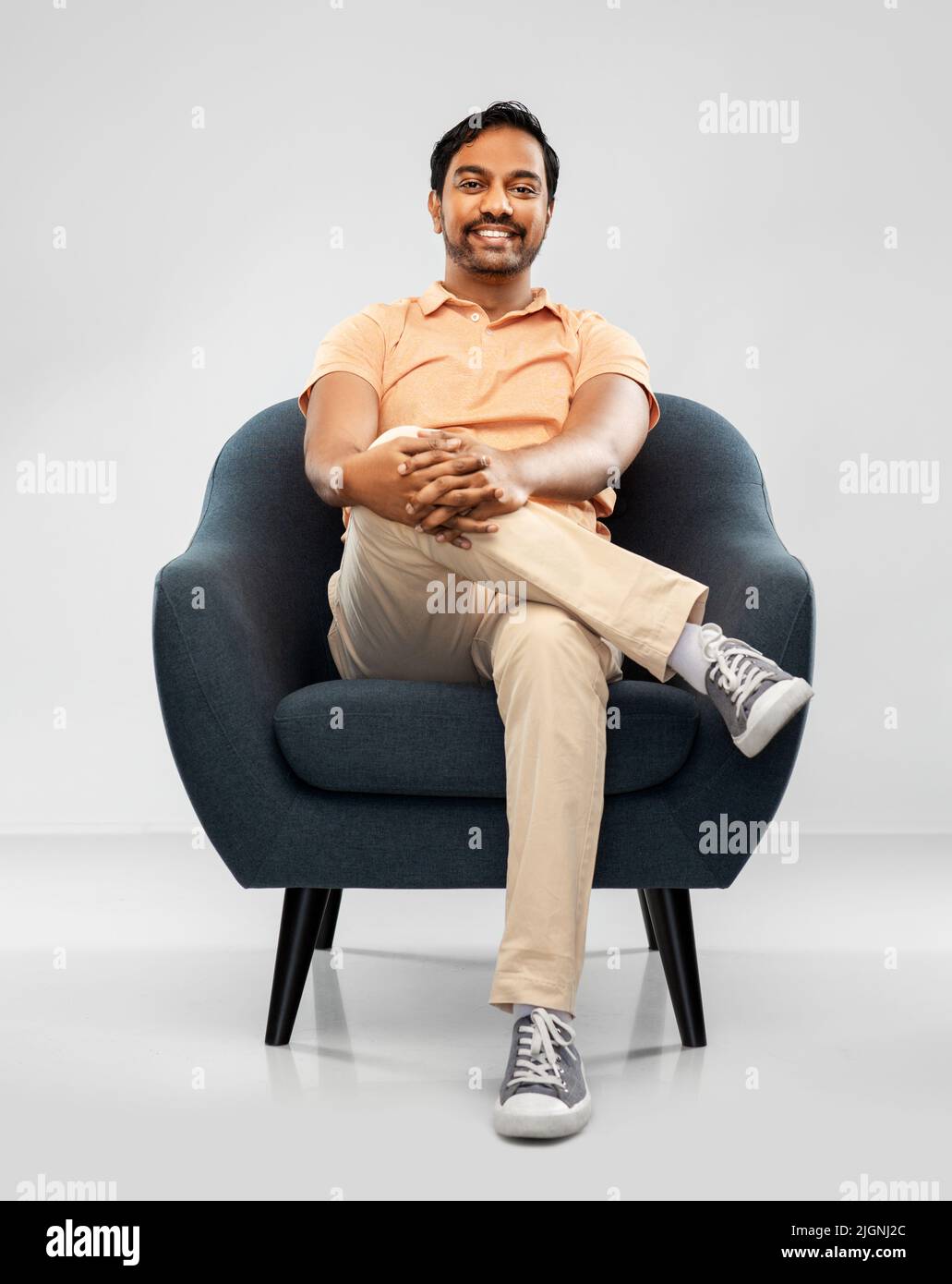 Man sitting indian style hi-res stock photography and images - Alamy