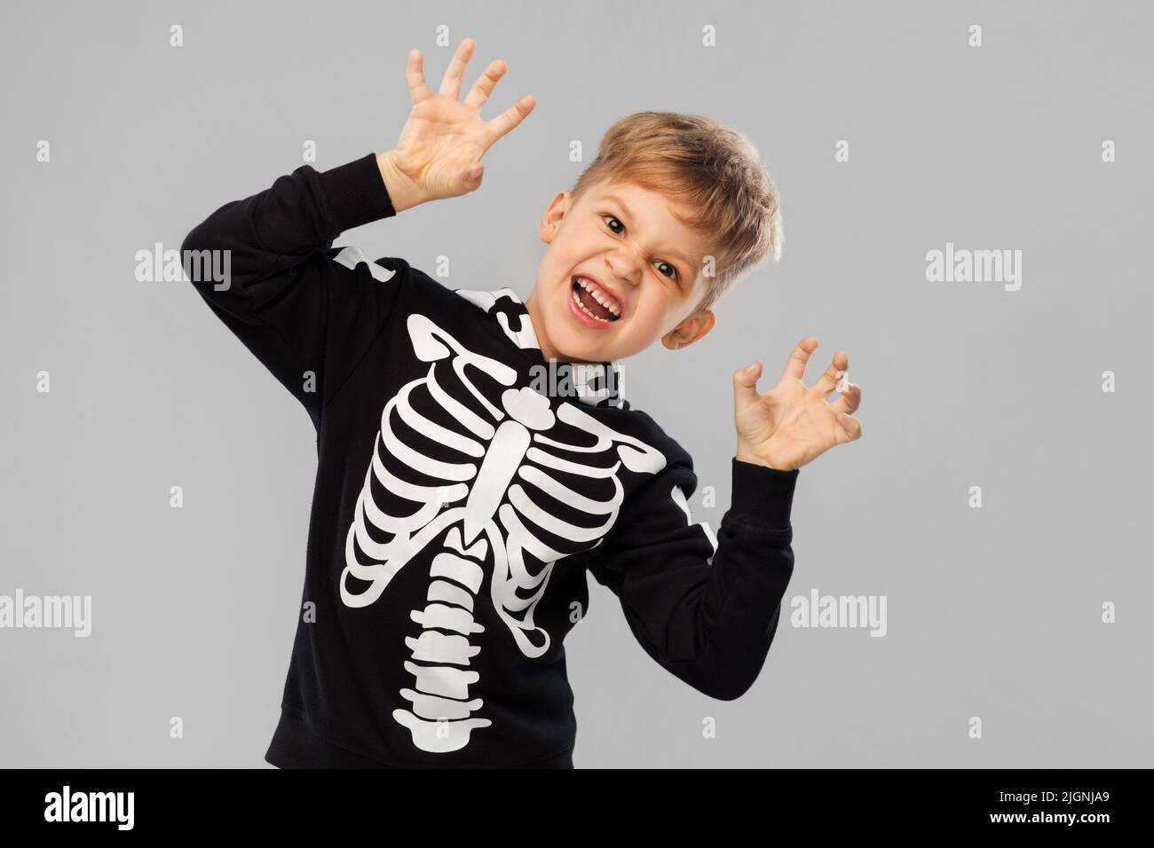 boy in halloween costume of skeleton making faces Stock Photo - Alamy