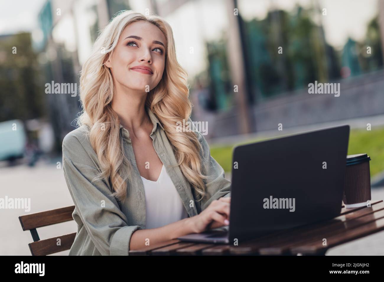 Portrait of attractive dreamy cheerful wavy haired girl copywriter ...