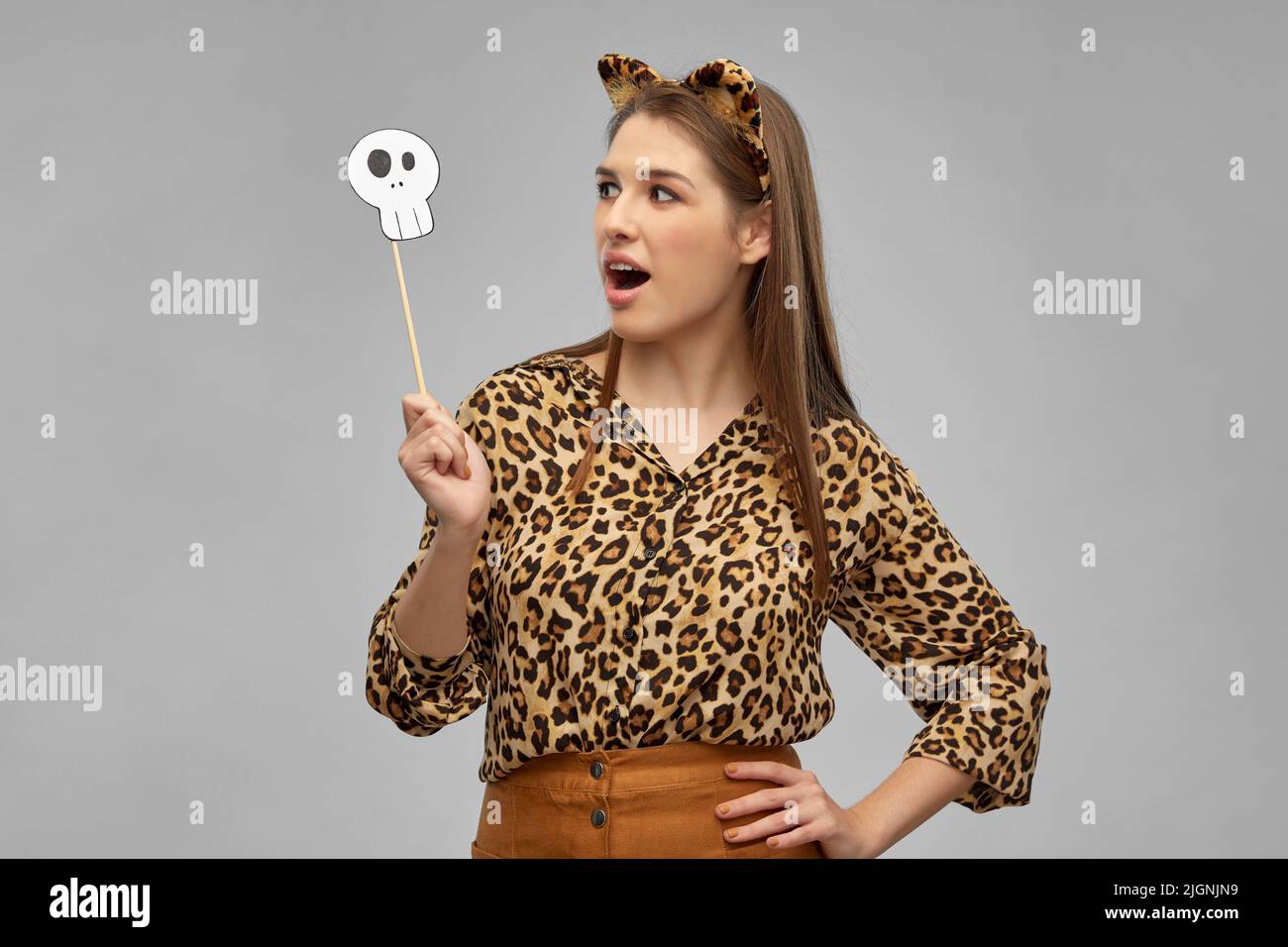 surprised woman in halloween costume of leopard Stock Photo - Alamy