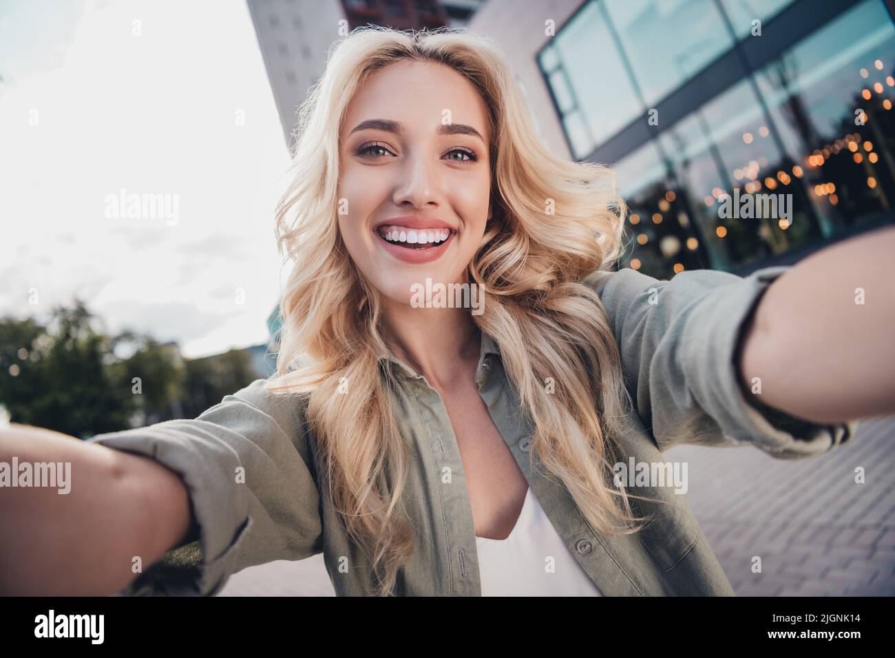 Self Portrait Of Attractive Cheerful Wavy Haired Girl Spending Sunny