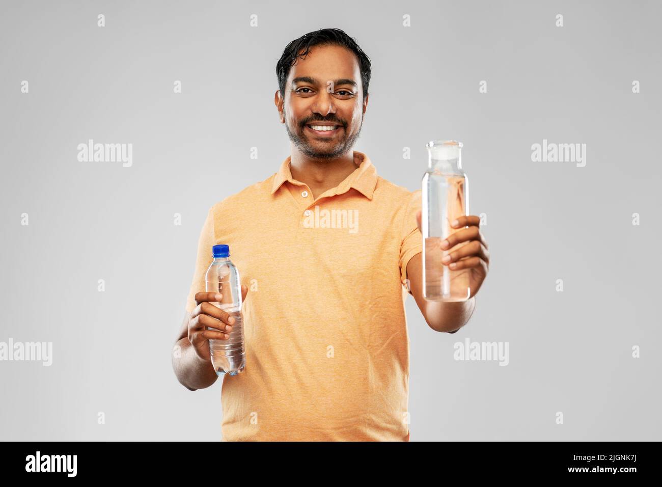 indian man comparing water in different bottles Stock Photo - Alamy