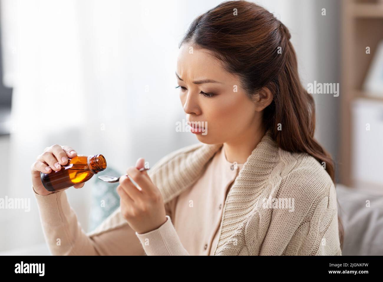 Taking cough syrup hi-res stock photography and images - Alamy