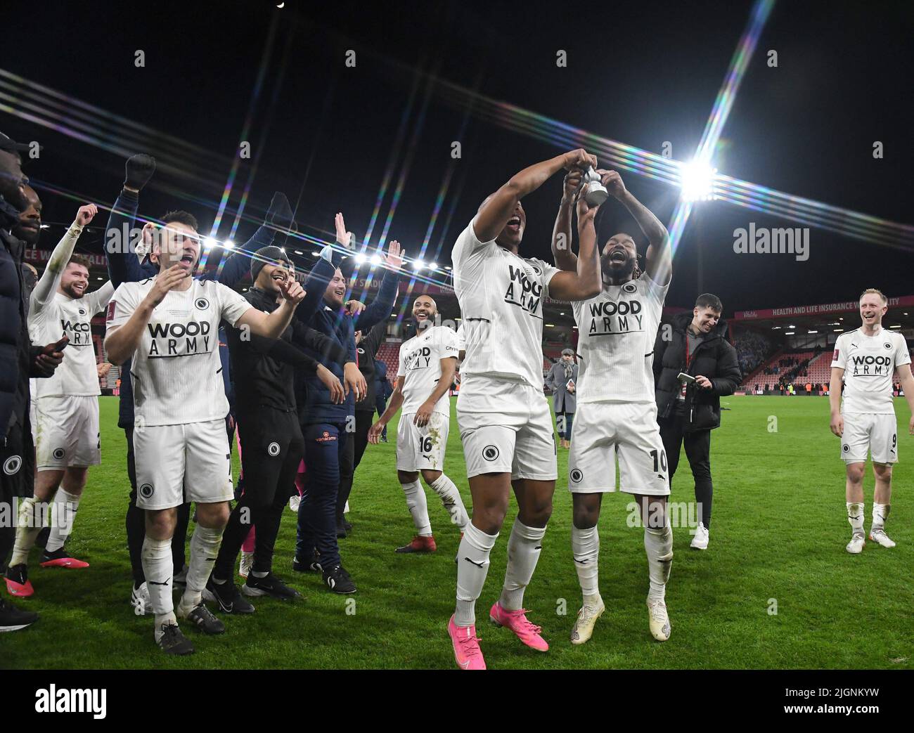 Boreham Wood players celebrate at full time with a miniature FA Cup ...