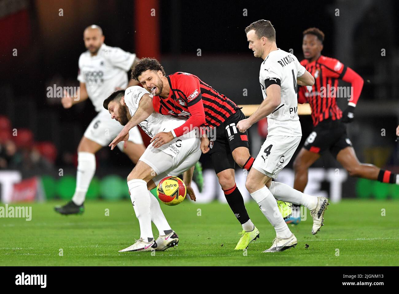 Emiliano Marcondes of AFC Bournemouth is tackled by Will Evans of ...