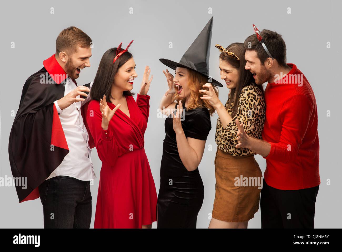 friends in halloween costumes scaring each other Stock Photo - Alamy