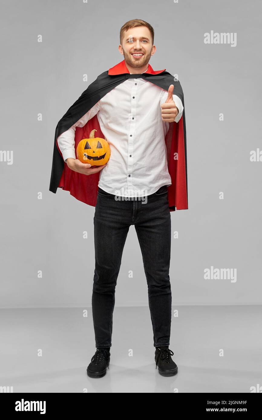 happy man in costume of vampire showing thumbs up Stock Photo - Alamy