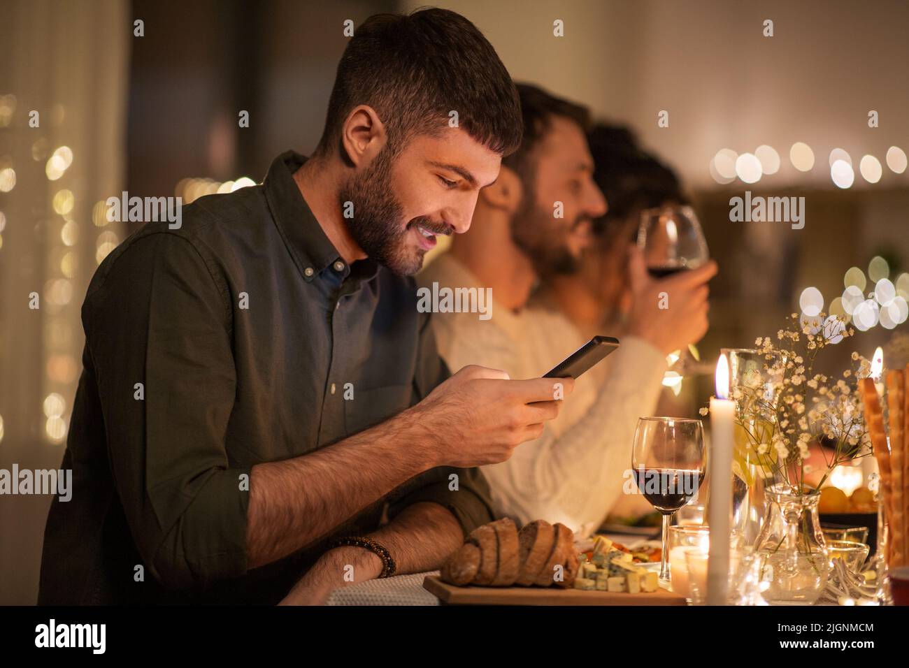 Smiling man dinner party hi-res stock photography and images - Alamy