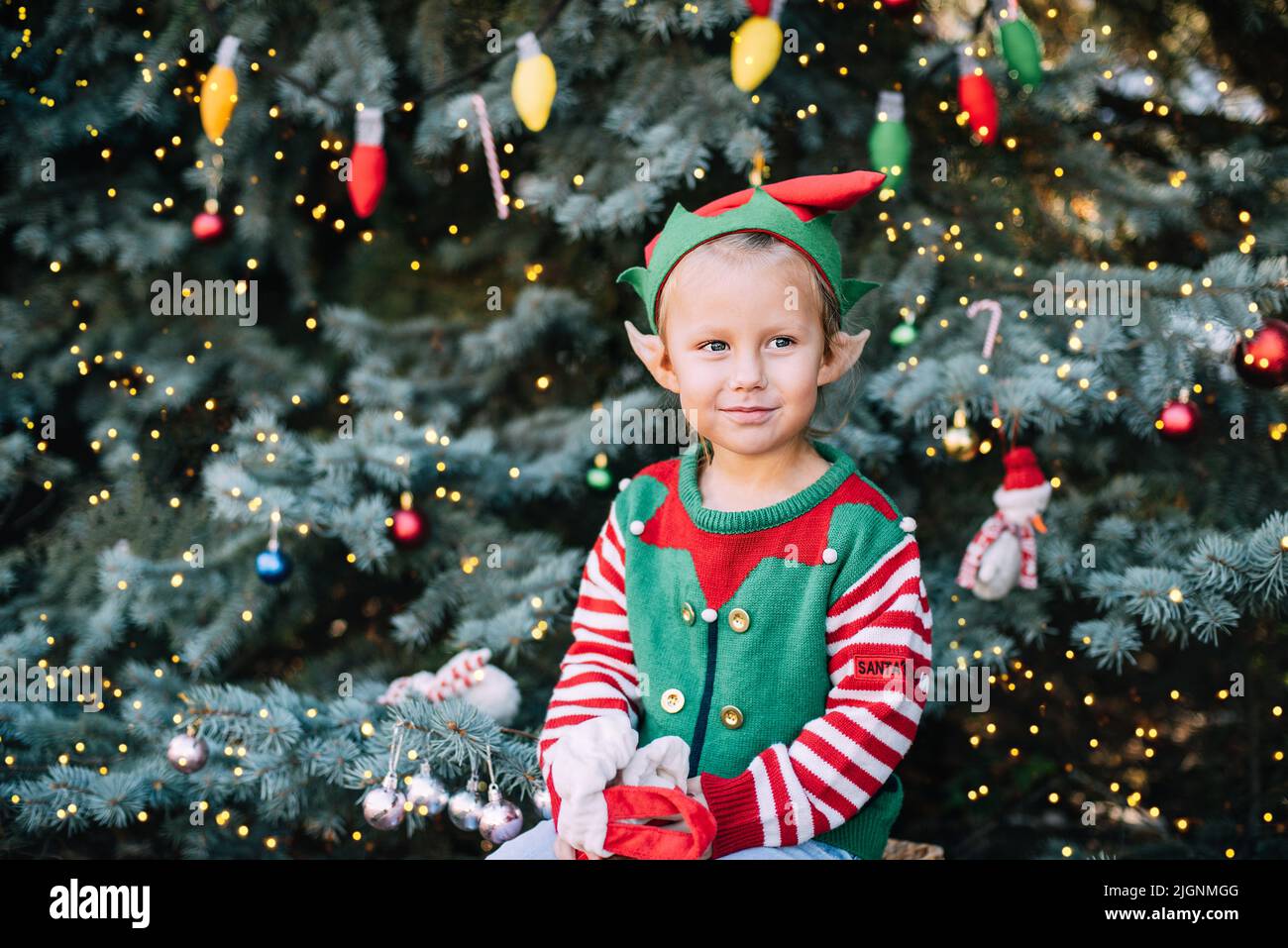 Christmas in july. children elf ears. Child waiting for Christmas in ...