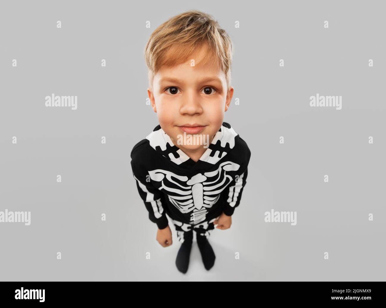 boy in black halloween costume with skeleton bones Stock Photo - Alamy