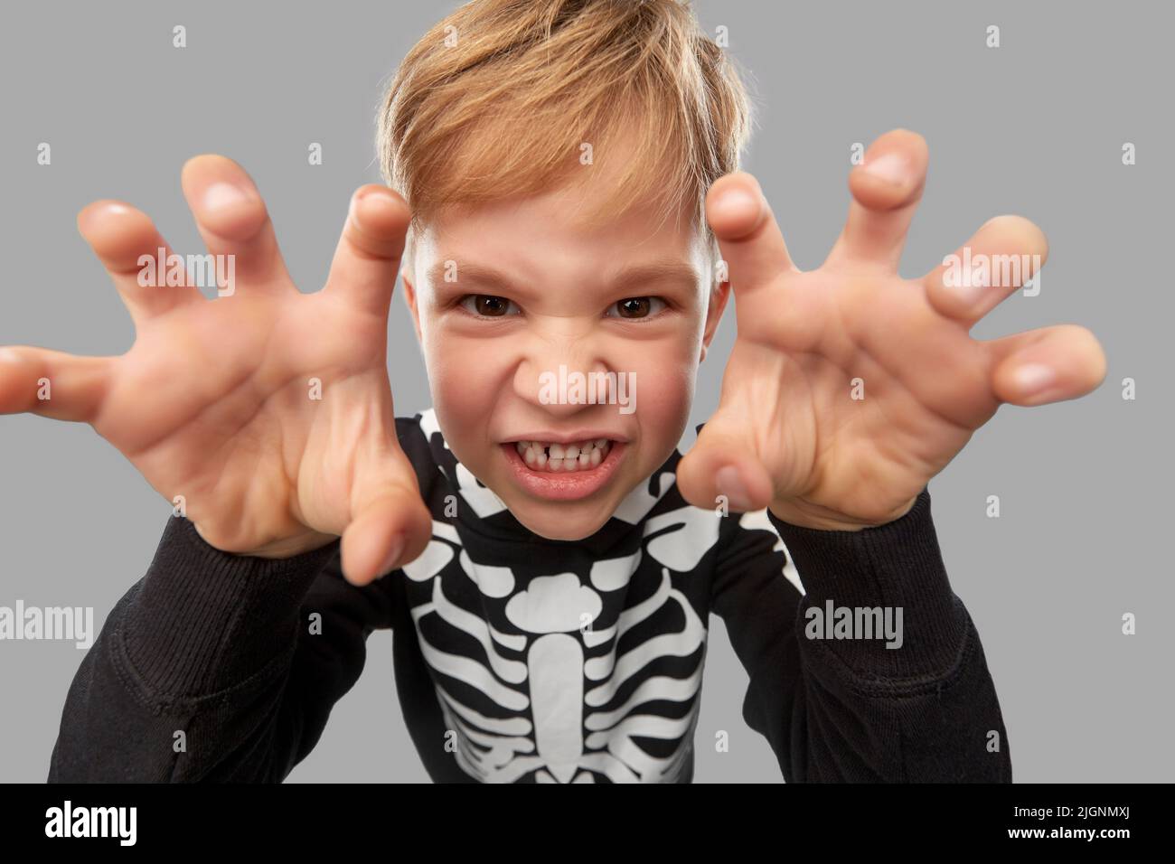 boy in halloween costume of skeleton making faces Stock Photo - Alamy
