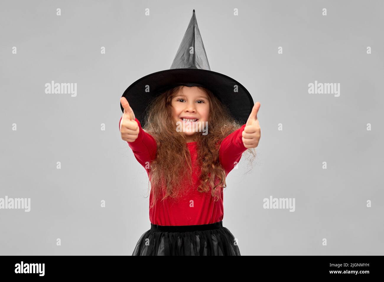 happy girl in black witch hat on halloween Stock Photo - Alamy