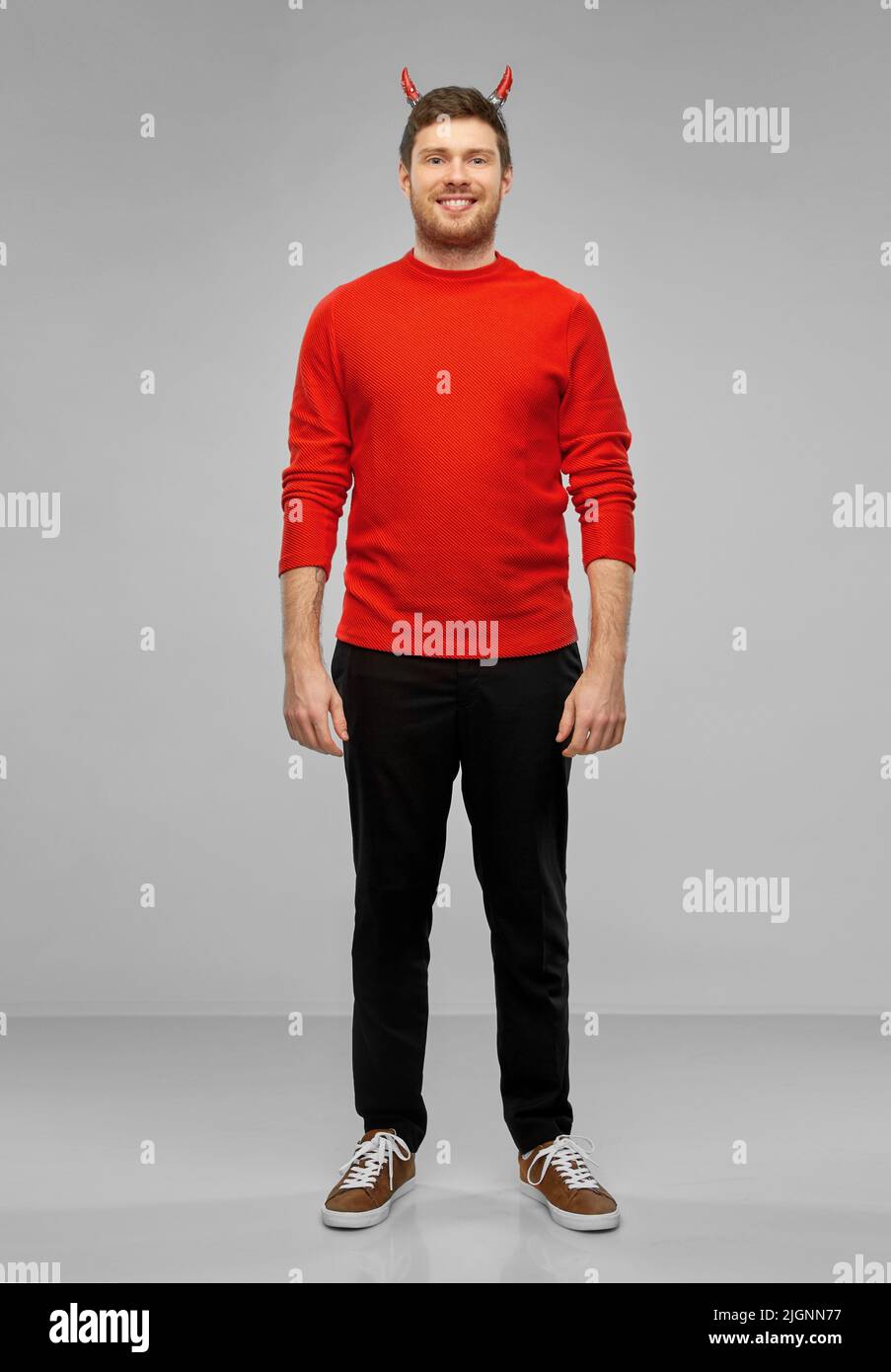 happy man in halloween costume of devil over grey Stock Photo - Alamy