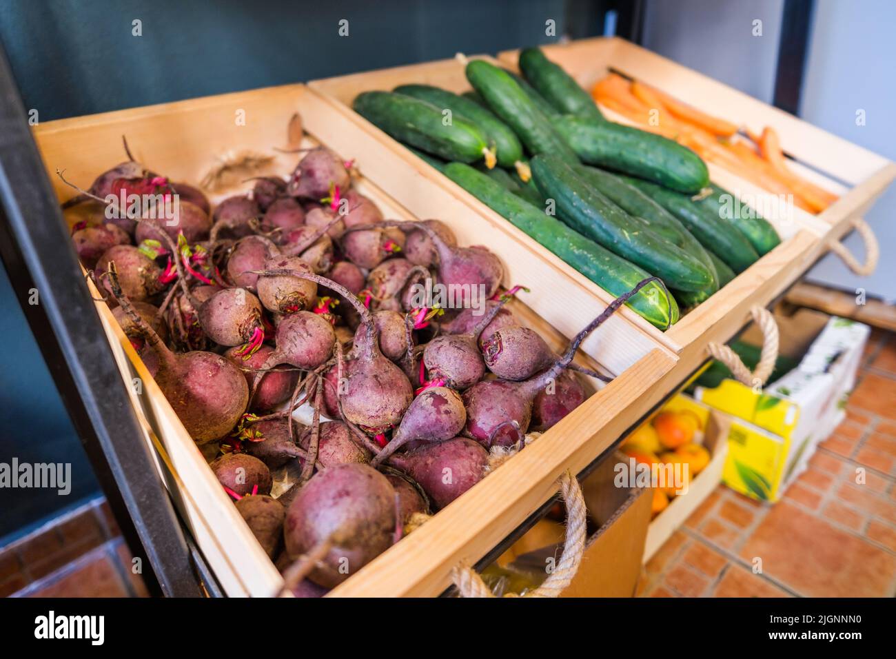 Healthy fruit and vegetables in grocery shop. Close up of basket with ...