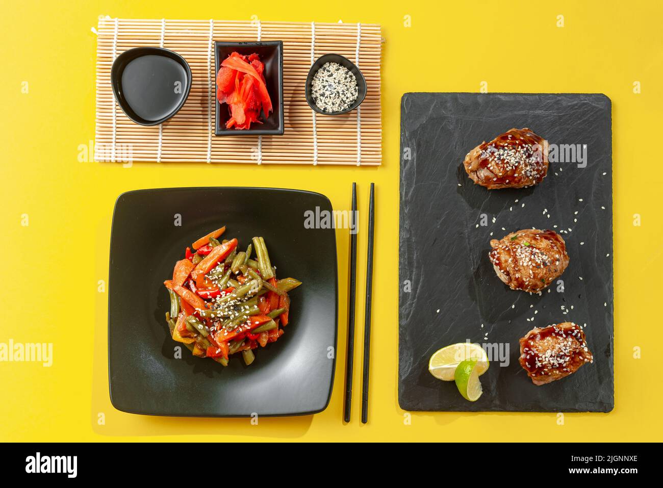 A mix of Asian food on a gray background. Delicious Chinese and Thai ...