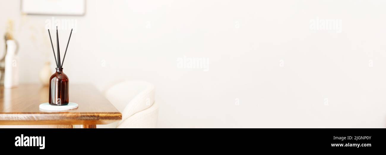 Aroma reed diffuser home fragrance with rattan sticks on a light ...