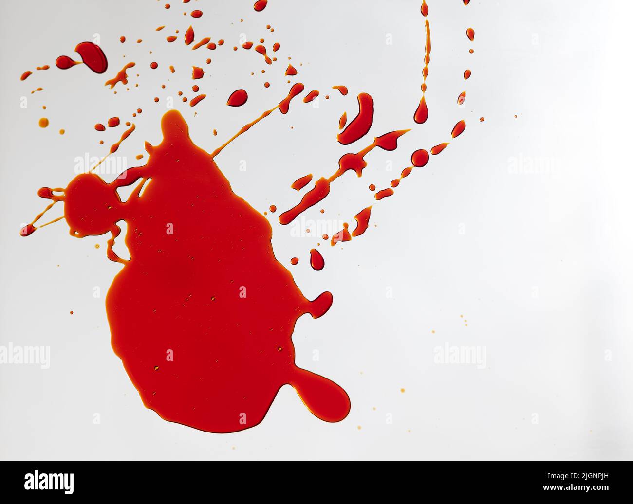 Composition of close up of red blood stains on white background Stock ...