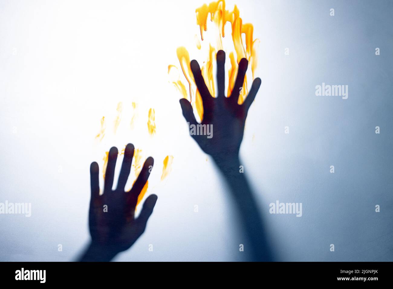 Composition of shape of black hands with blood stains on white ...