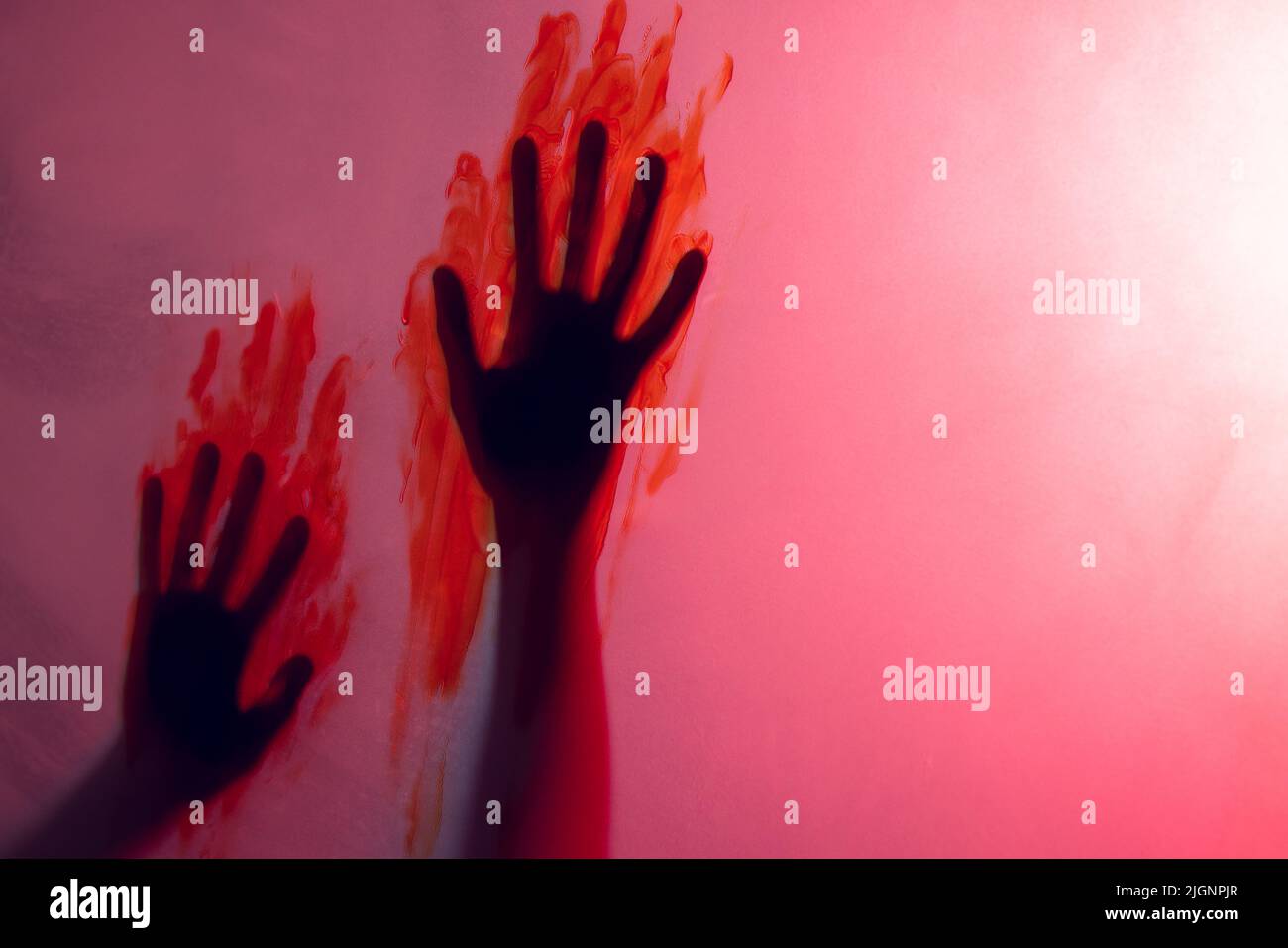 Composition of shape of hands with blood stains on red background Stock ...