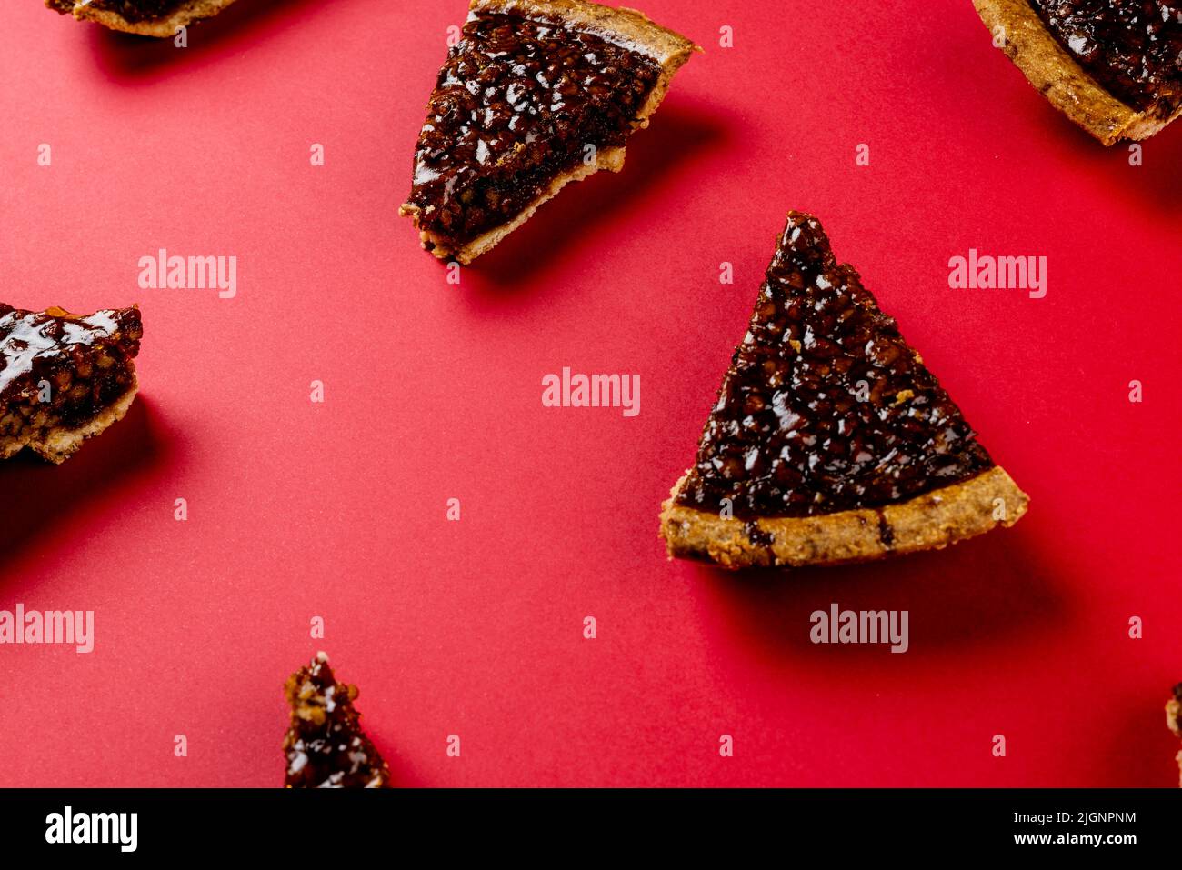 Composition of multiple pieces of pie on red background Stock Photo - Alamy