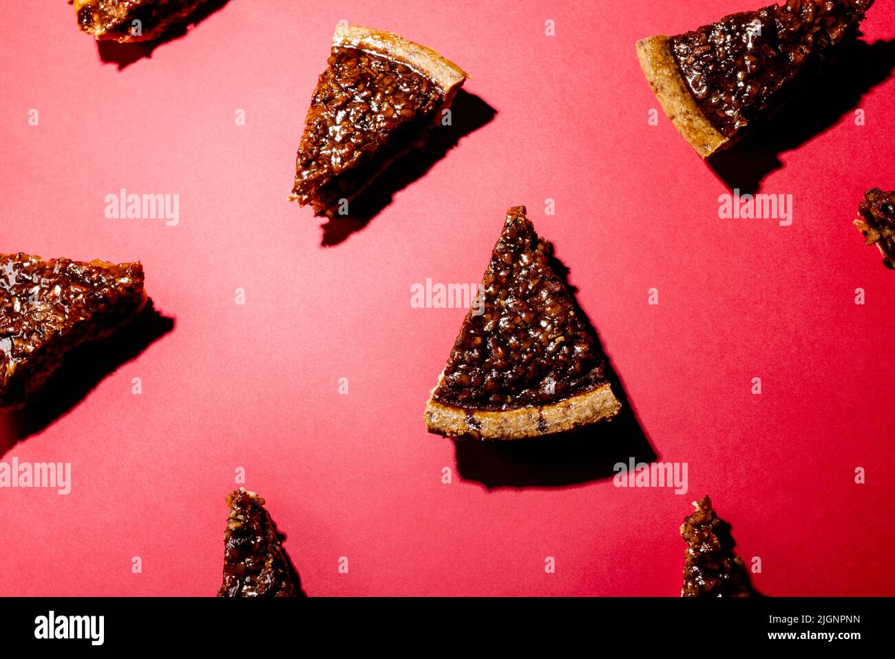Composition of multiple pieces of pie on red background Stock Photo - Alamy