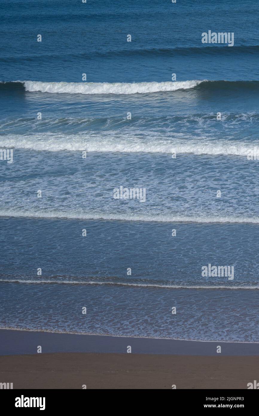 patterns in waves on north east english beach in spring Stock Photo - Alamy