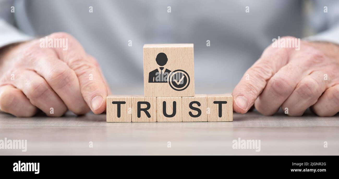 Wooden blocks with symbol of trust concept Stock Photo - Alamy