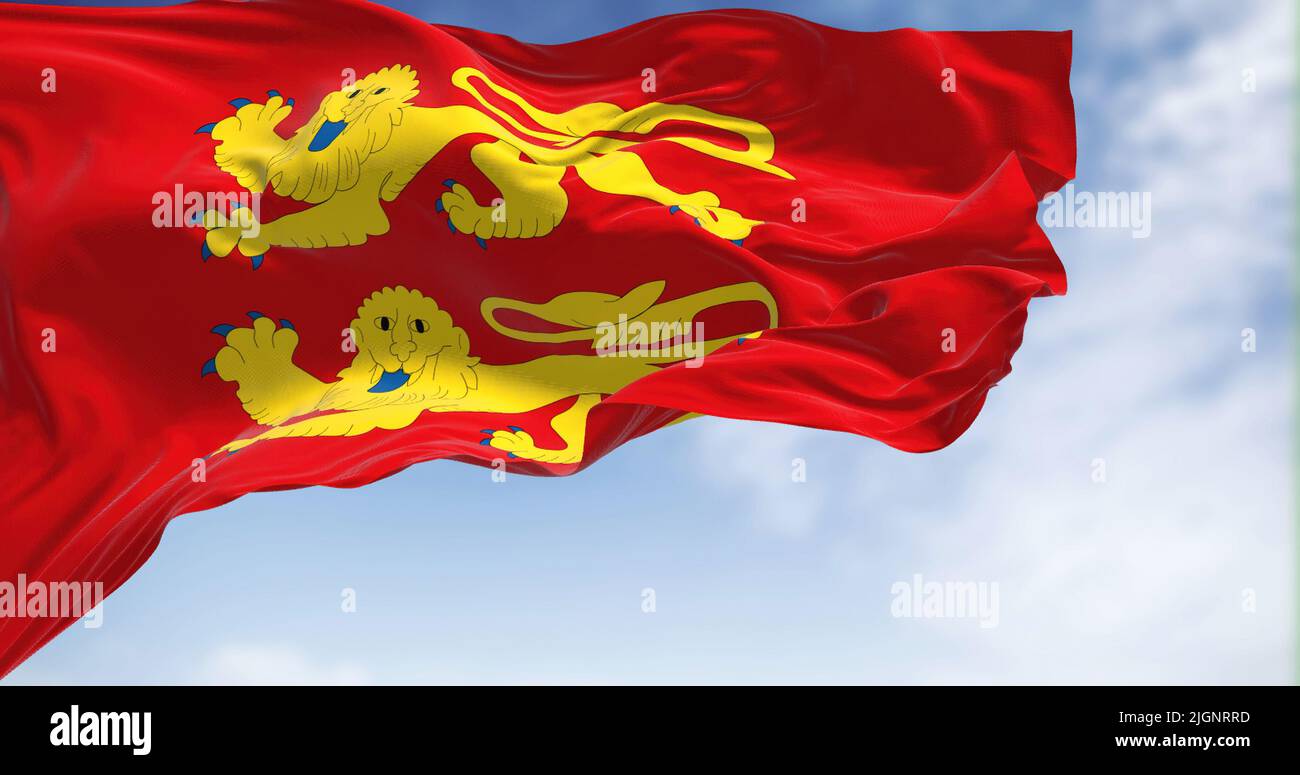 The flag of Normandy region waving in the wind on a clear day. Normandy ...