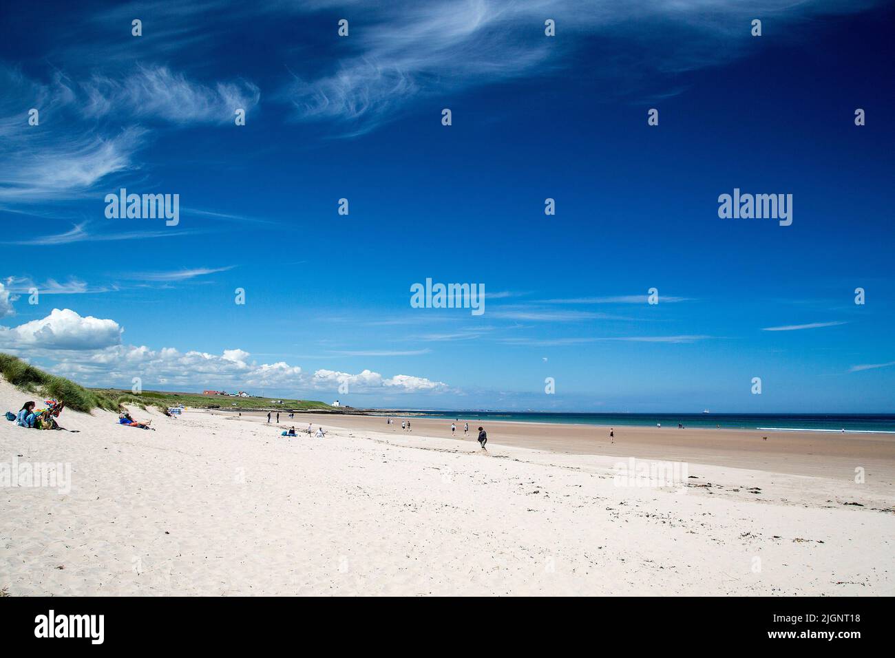 The beach at Bamburgh Castle, Bamburgh, Northumberland, UK ,on a bright ...