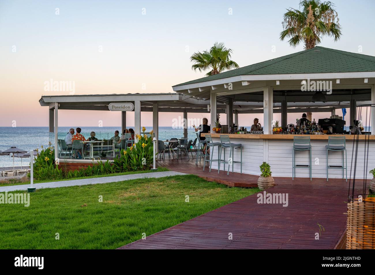 Beach bar at Faliraki Beach during sunset on Rhodes Island in Greece ...