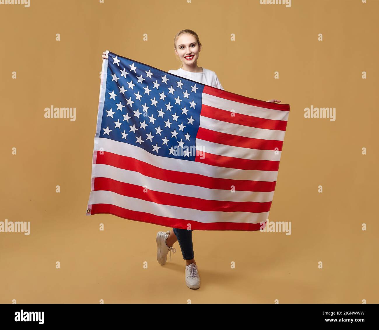 attractive blonde poses with an American flag. photo shoot in the ...