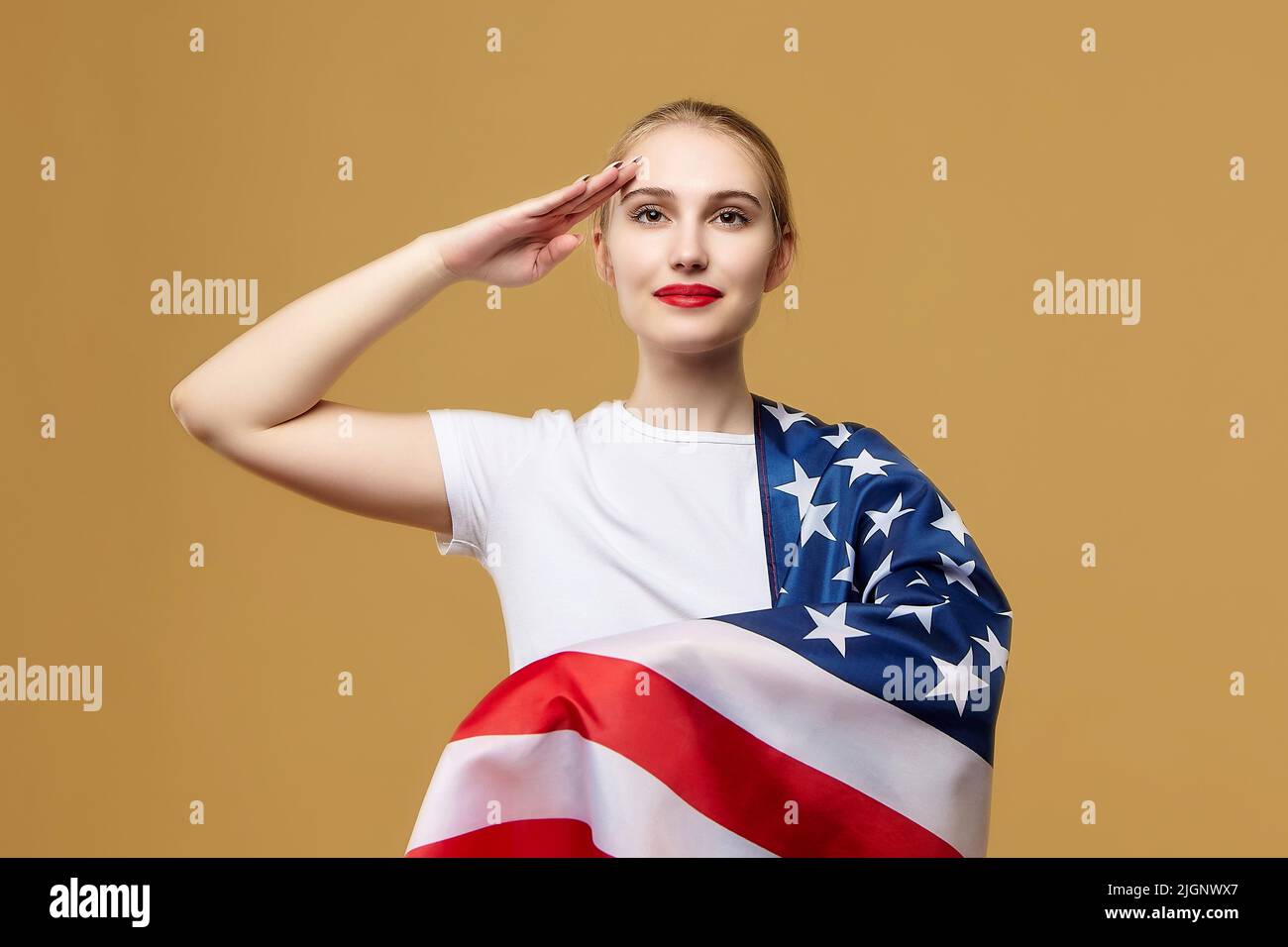 attractive blonde proudly poses with an American flag. photo shoot in ...