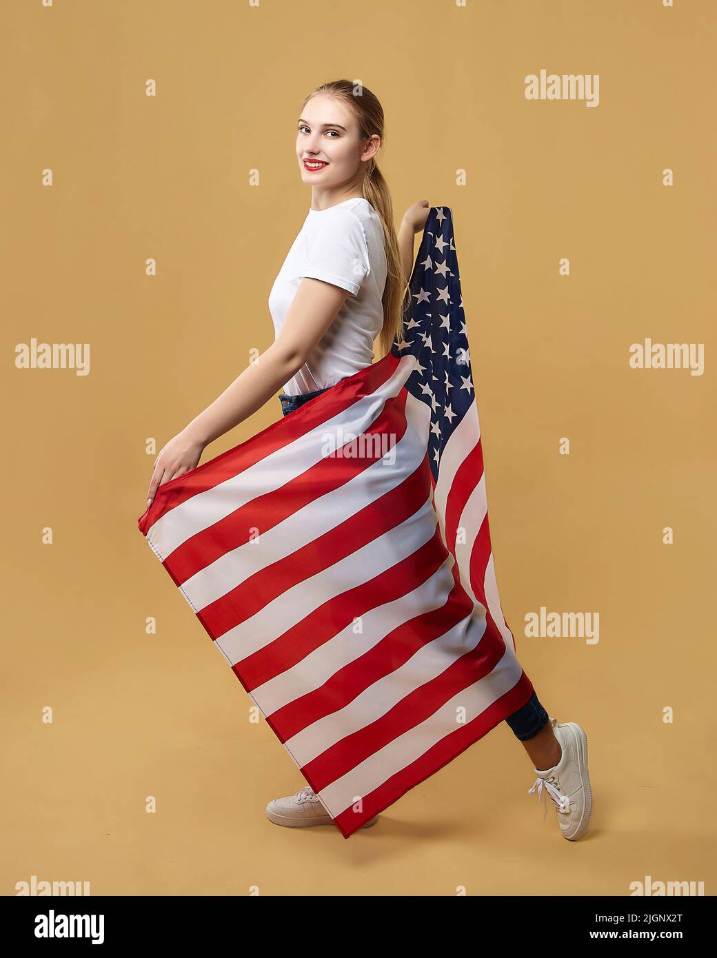 attractive blonde poses with an American flag. photo shoot in the ...