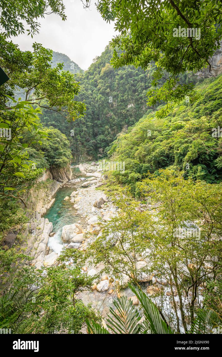 Beautiful natural scenic of river inside the valley with green forest ...