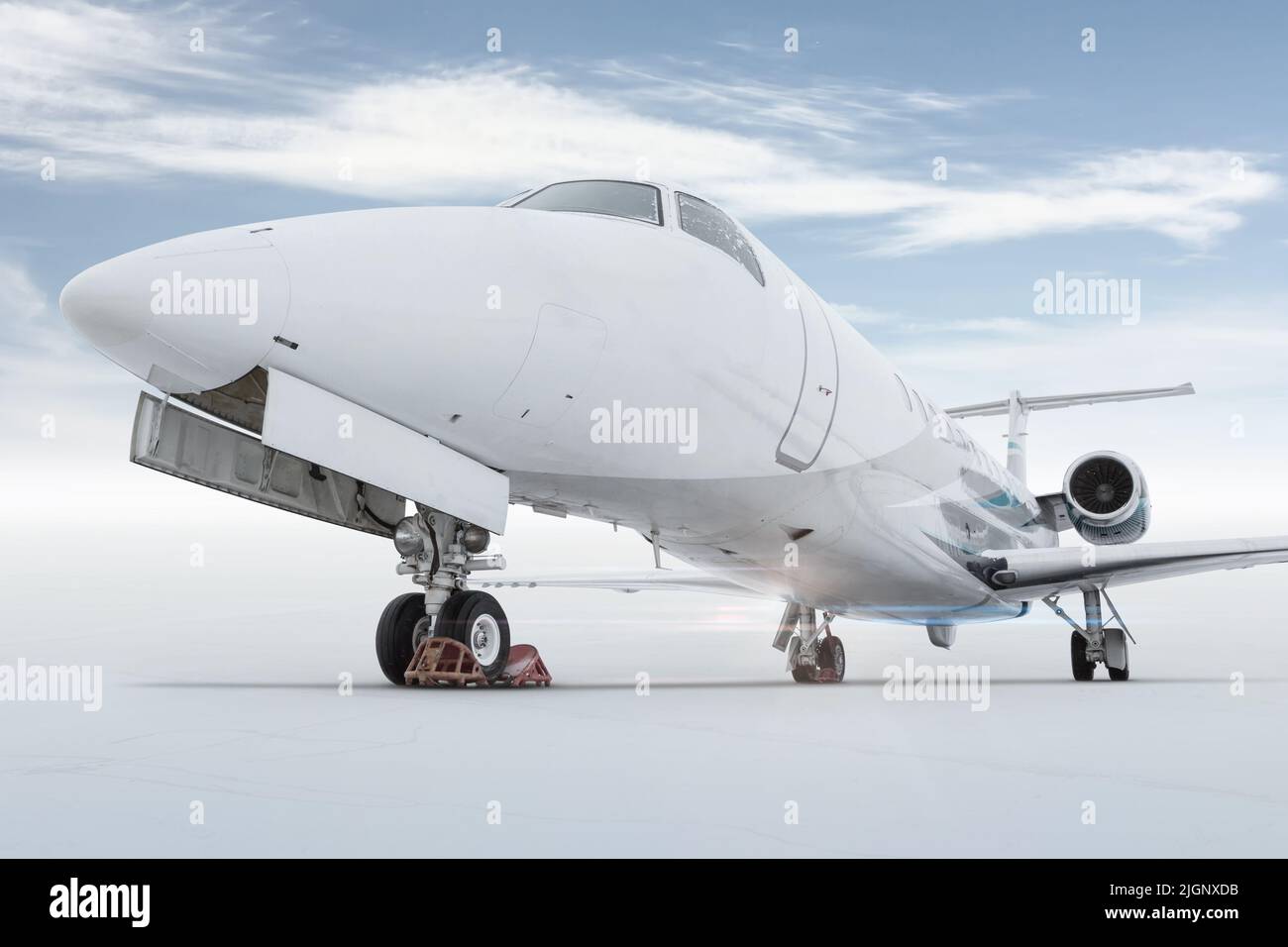 Close-up of a modern private jet isolated on bright background with sky ...