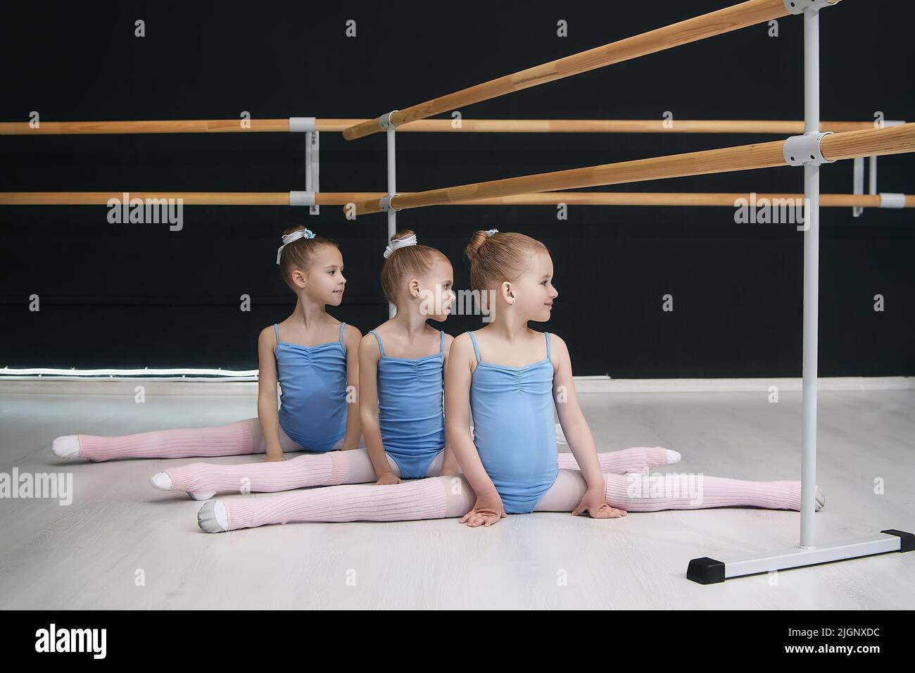 little girls sit on the split. classes at the choreographic school ...