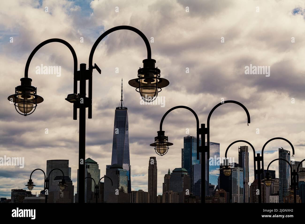 Broken street lamps on the background of the New York City and cloudy ...