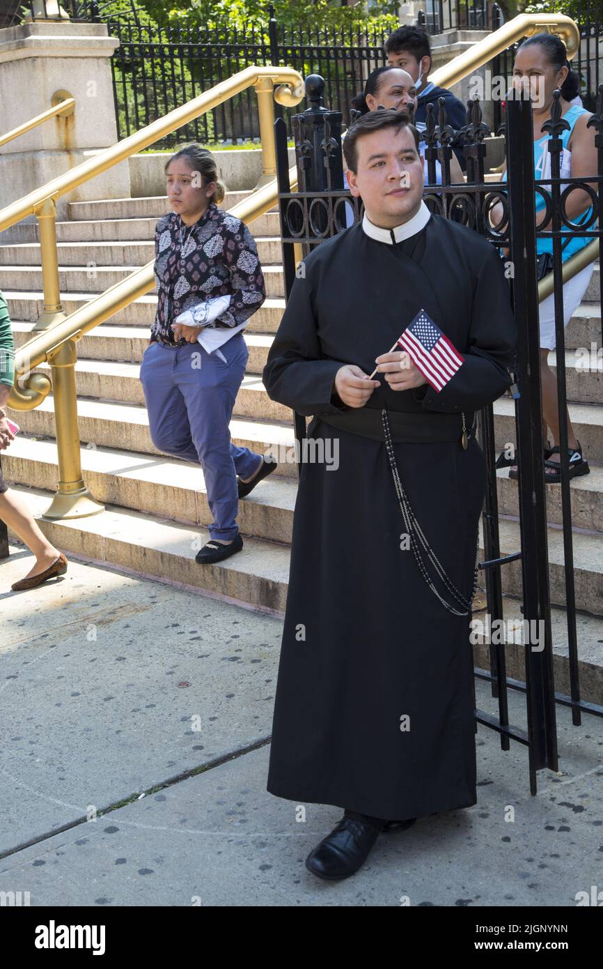 Young priest holding usa flag hi-res stock photography and images - Alamy