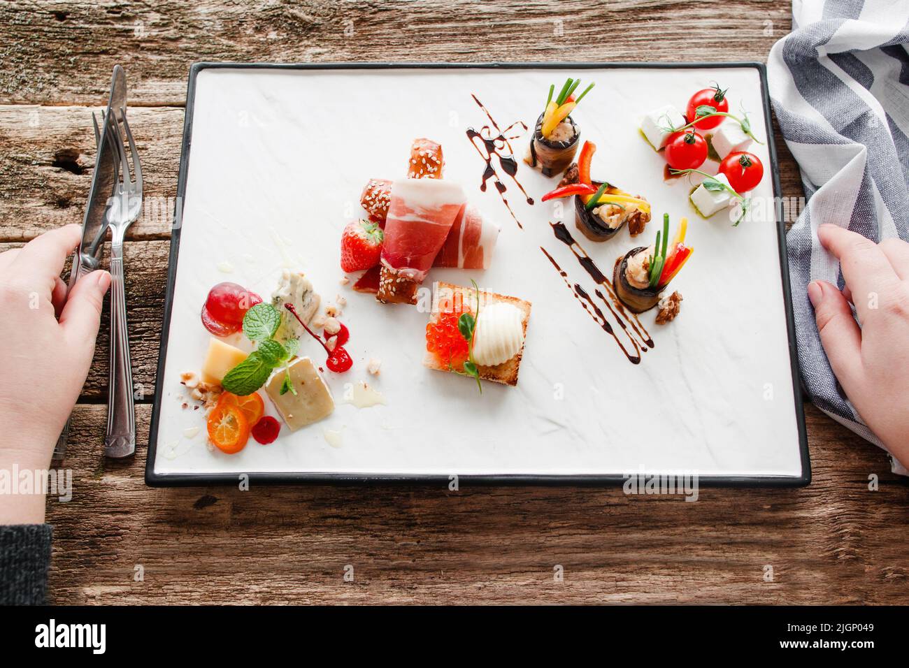 Tasting appetizer at restaurant flat lay eater pov Stock Photo - Alamy