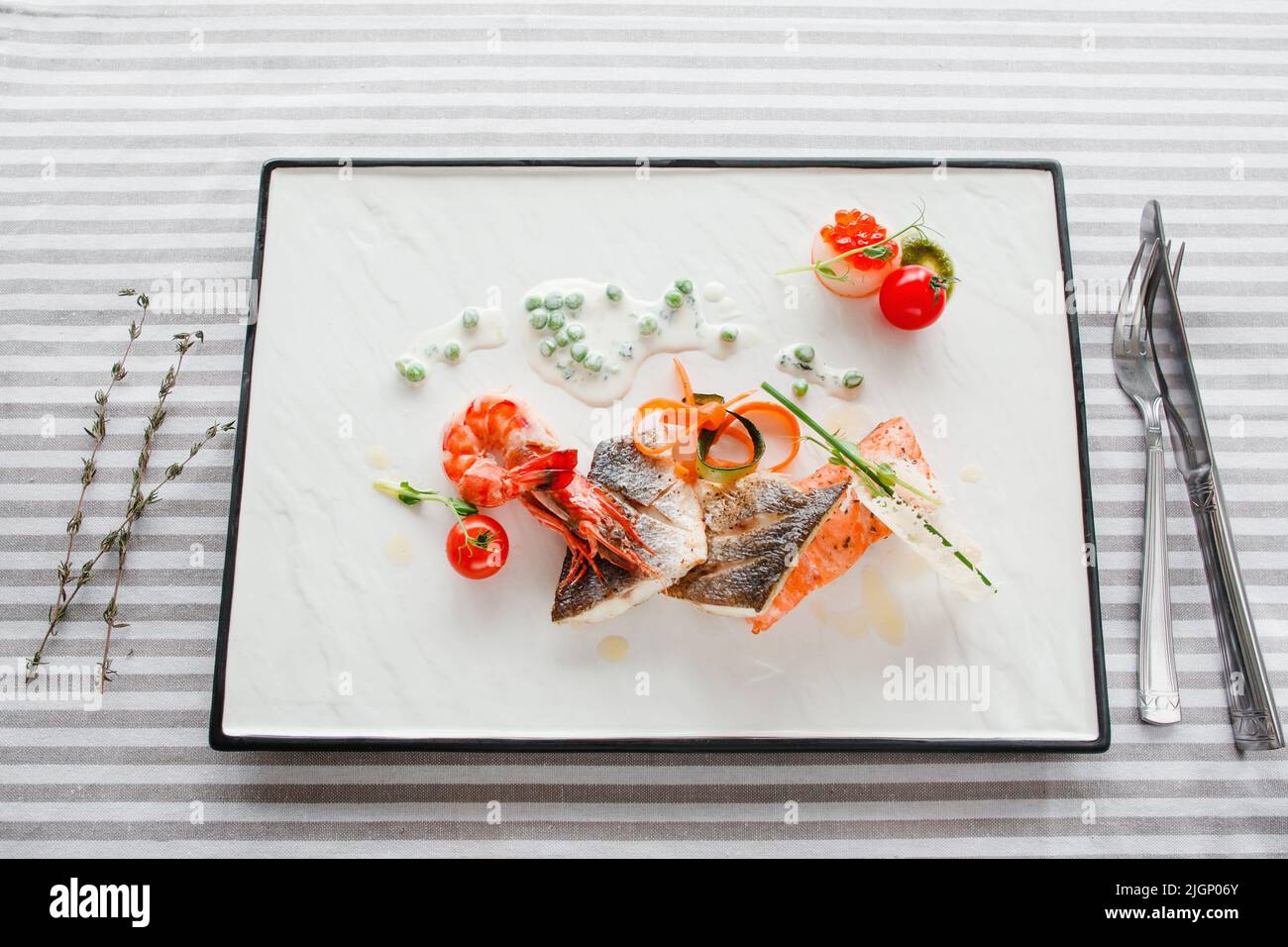 Grilled fish fillet and shrimp with vegetables Stock Photo - Alamy