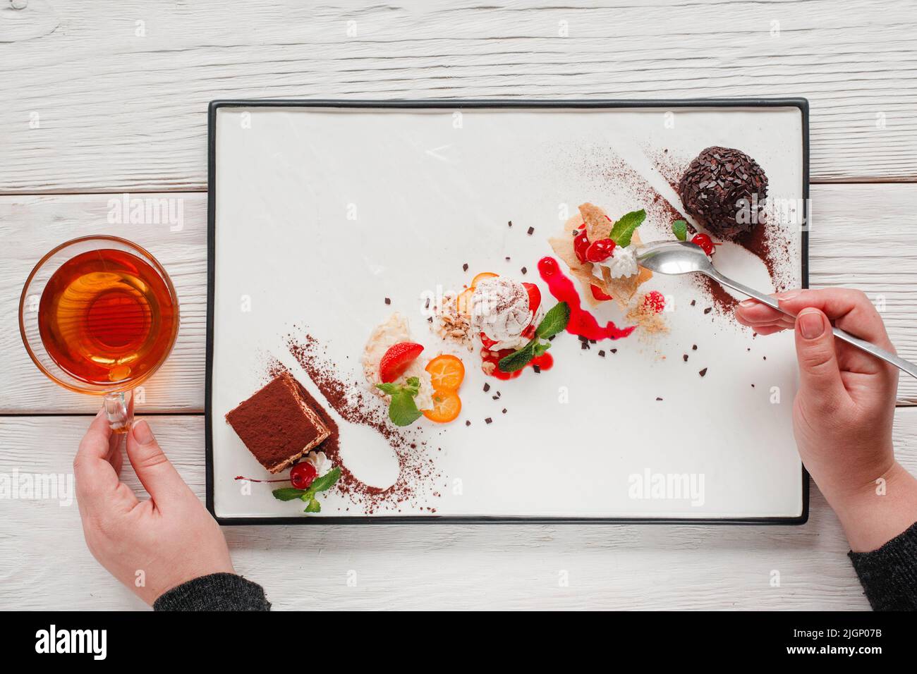 Sweet cakes mix eating top view, eater pov Stock Photo - Alamy